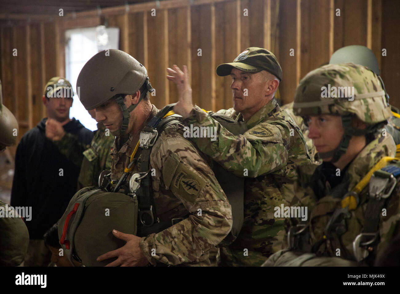 A U.S. Army jumpmaster conducts Jumpmaster Personnel Inspections (JMPI ...