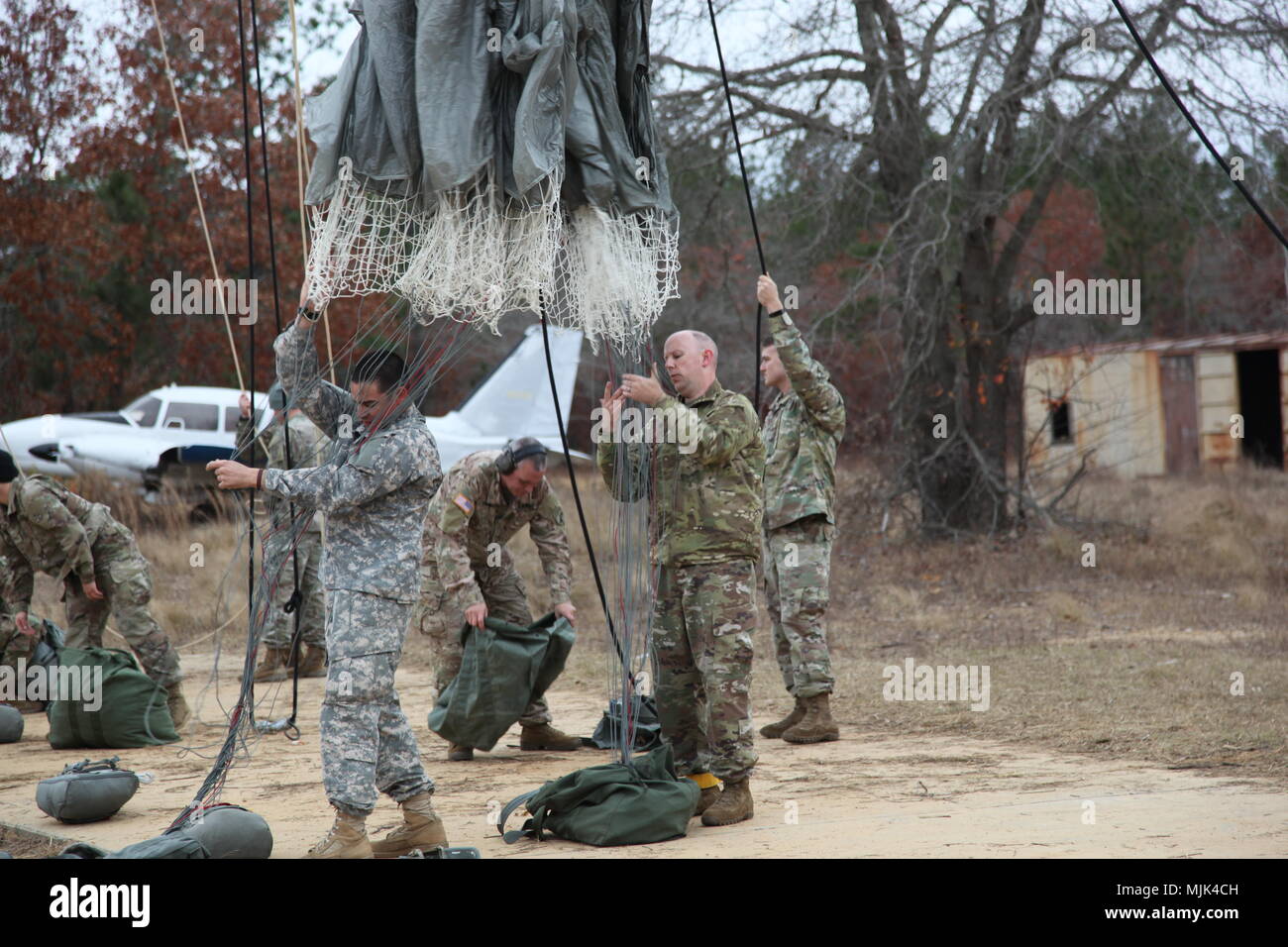 U.S Army Paratroopers performs chute shake-out after their descent for ...