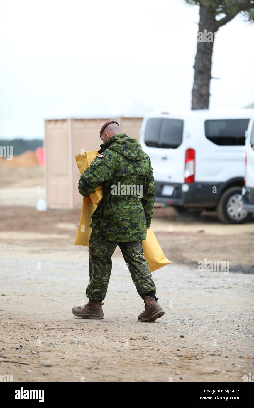 A Canadian jumpmaster leaves Luzon Drop Zone after the final foreign ...