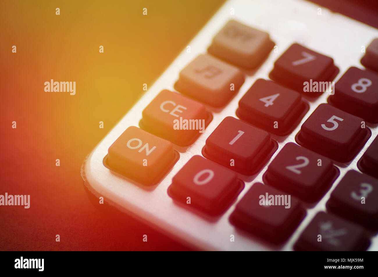 calculator on wood table Stock Photo - Alamy