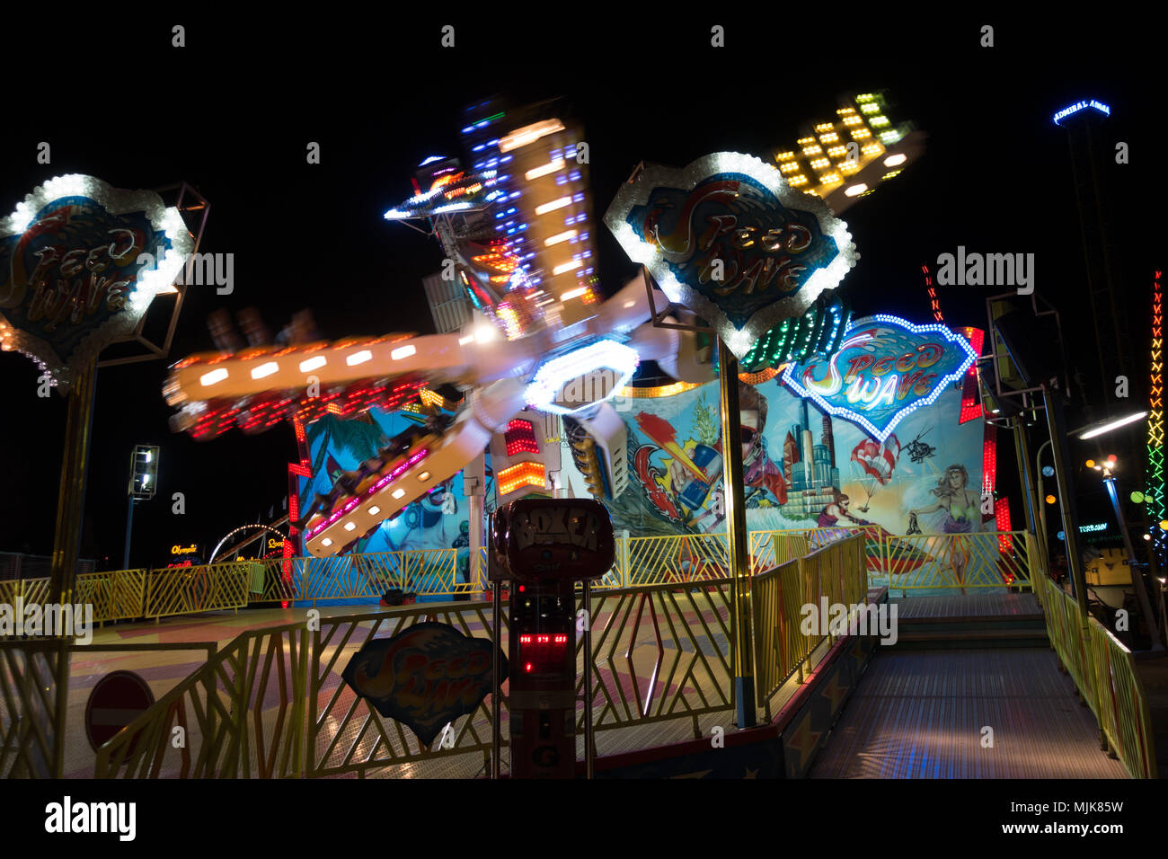 Amusement park ride at night Stock Photo - Alamy