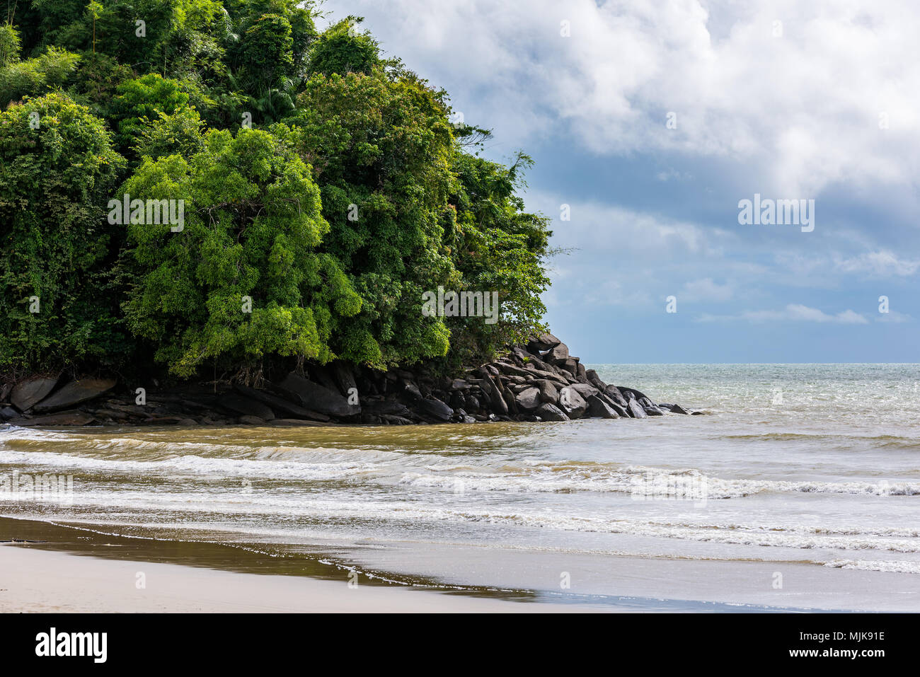 The beach has rocky outcrops in the sea Stock Photo - Alamy