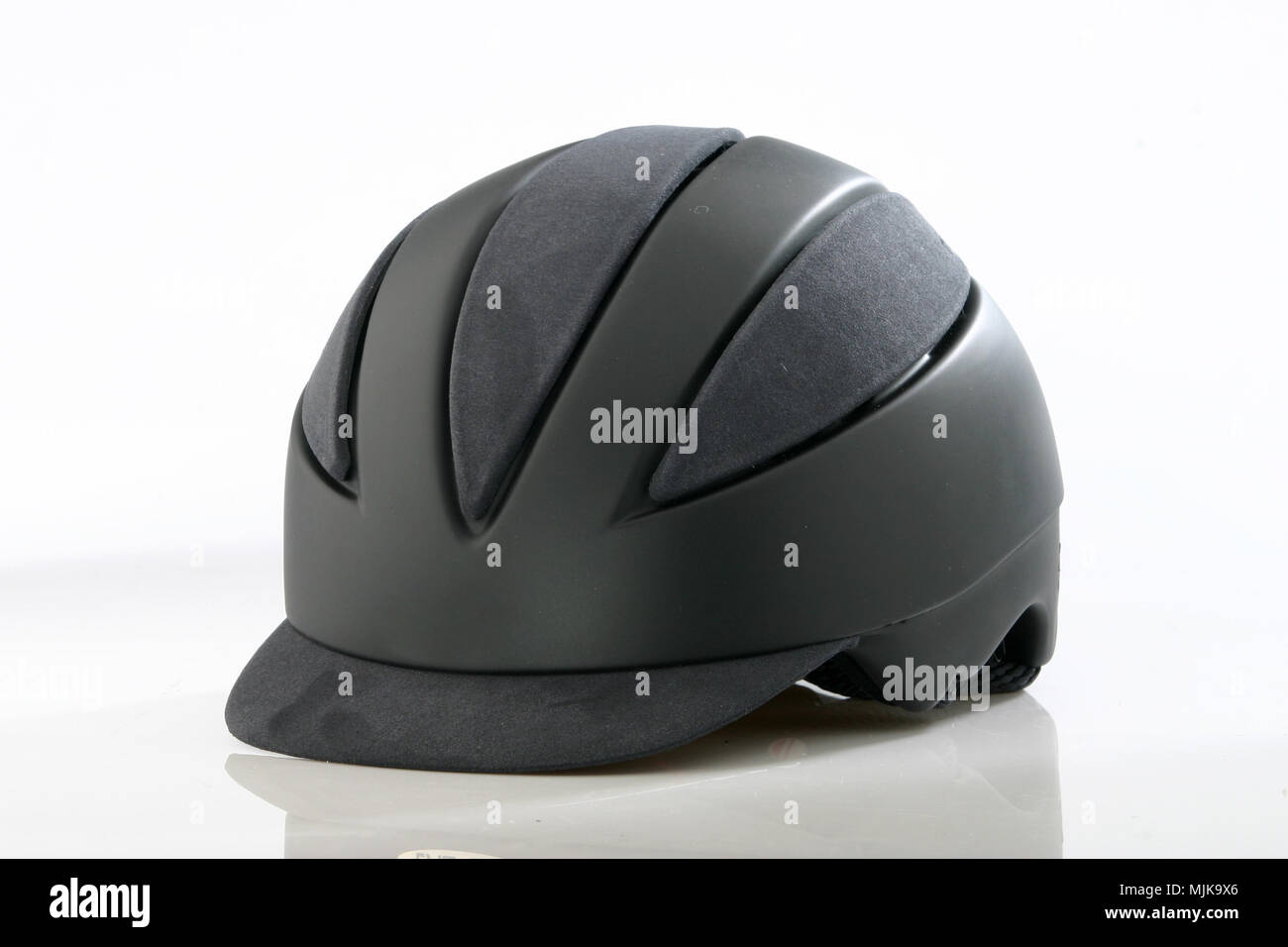 Black helmet on white background Stock Photo - Alamy