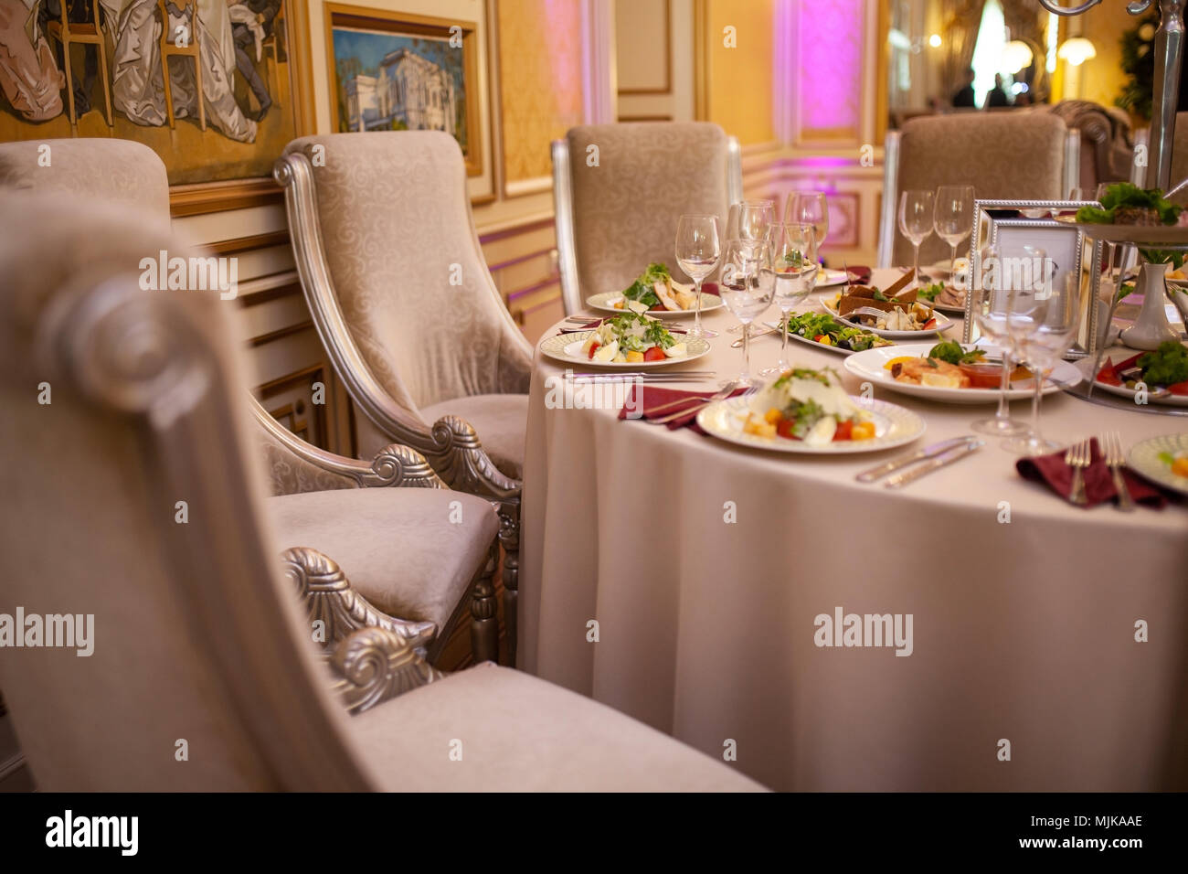 Table in the restaurant with food dishes Stock Photo - Alamy