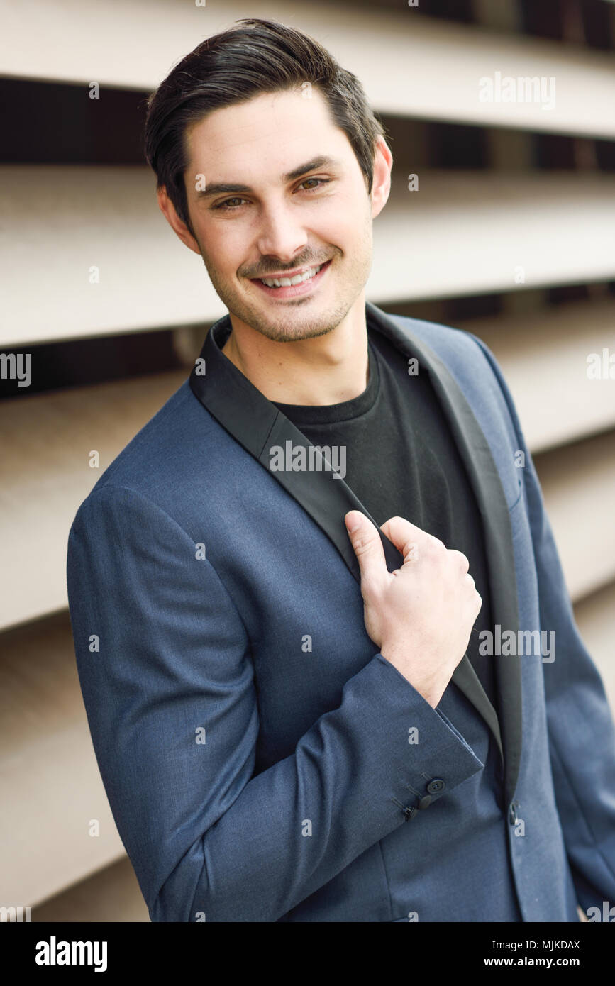 Portrait of an attractive man, model of fashion, wearing modern suit ...