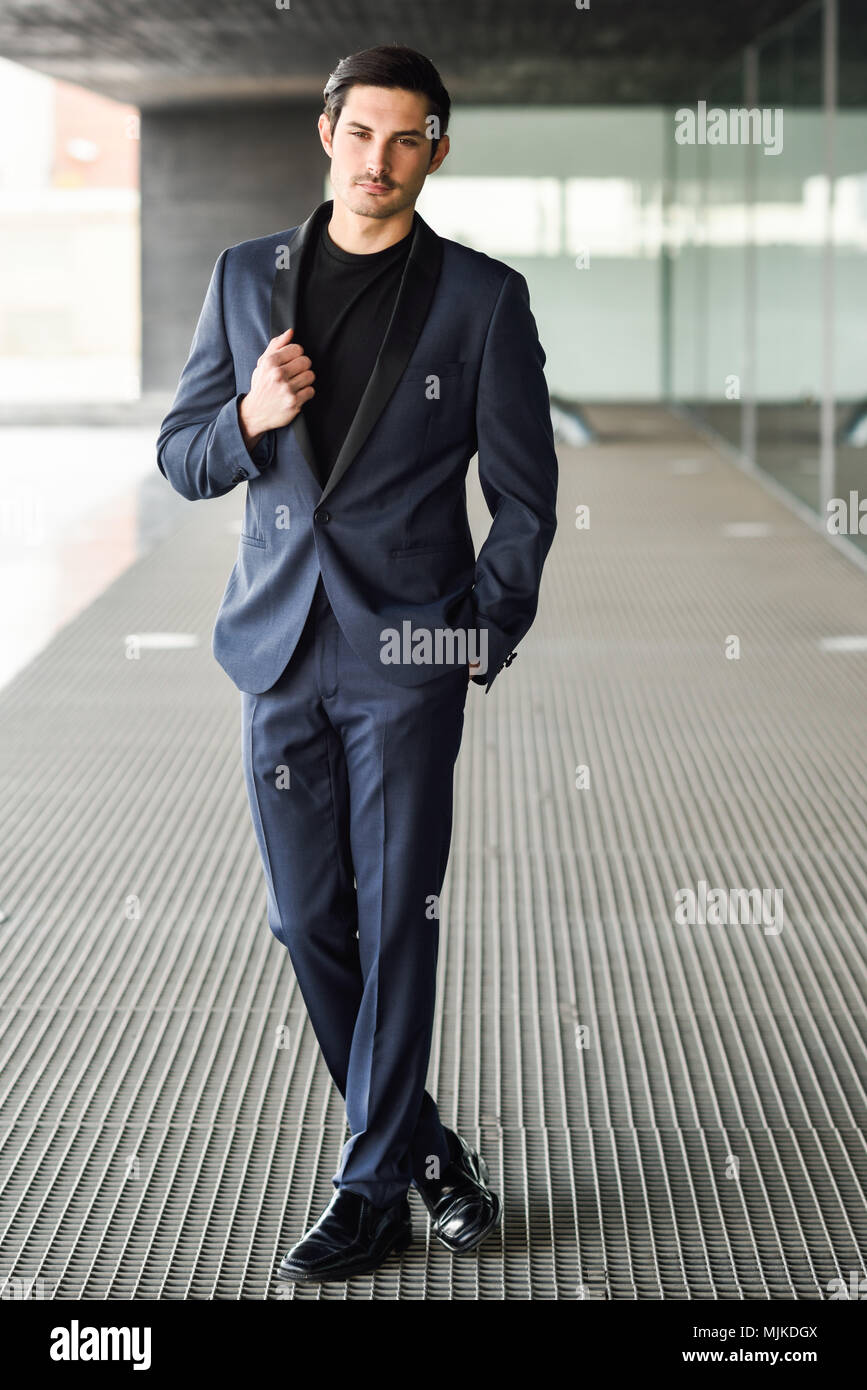 Portrait of an attractive man, model of fashion, wearing modern suit ...