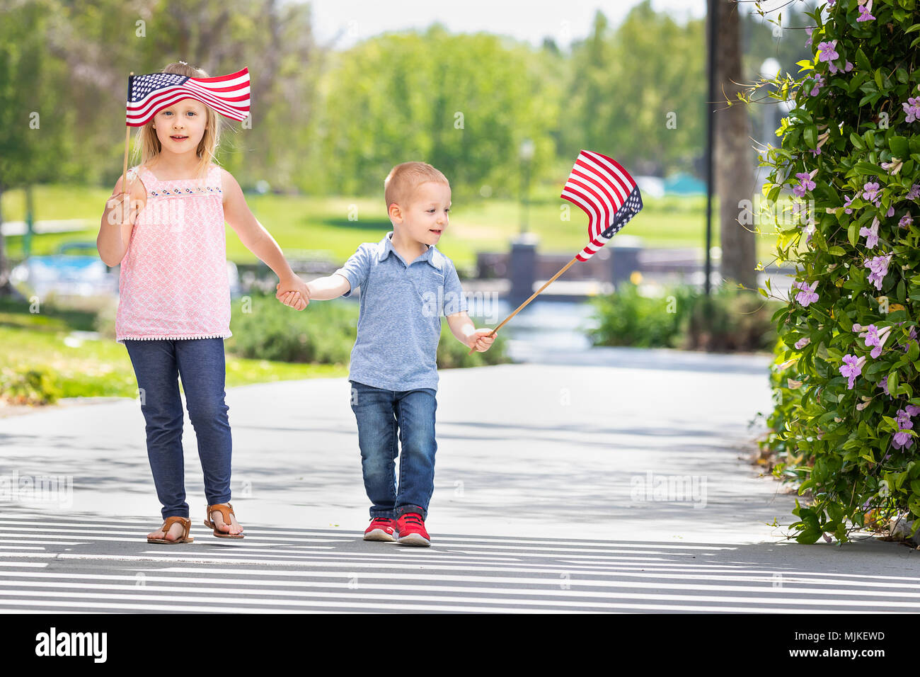 Young Sister and Brother Waving American Flags At The Park Stock Photo ...