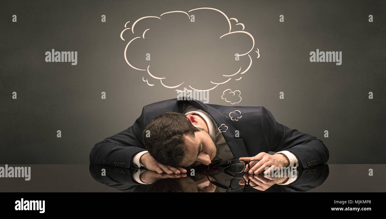 Young businessman sleeping and dreaming at the office Stock Photo - Alamy