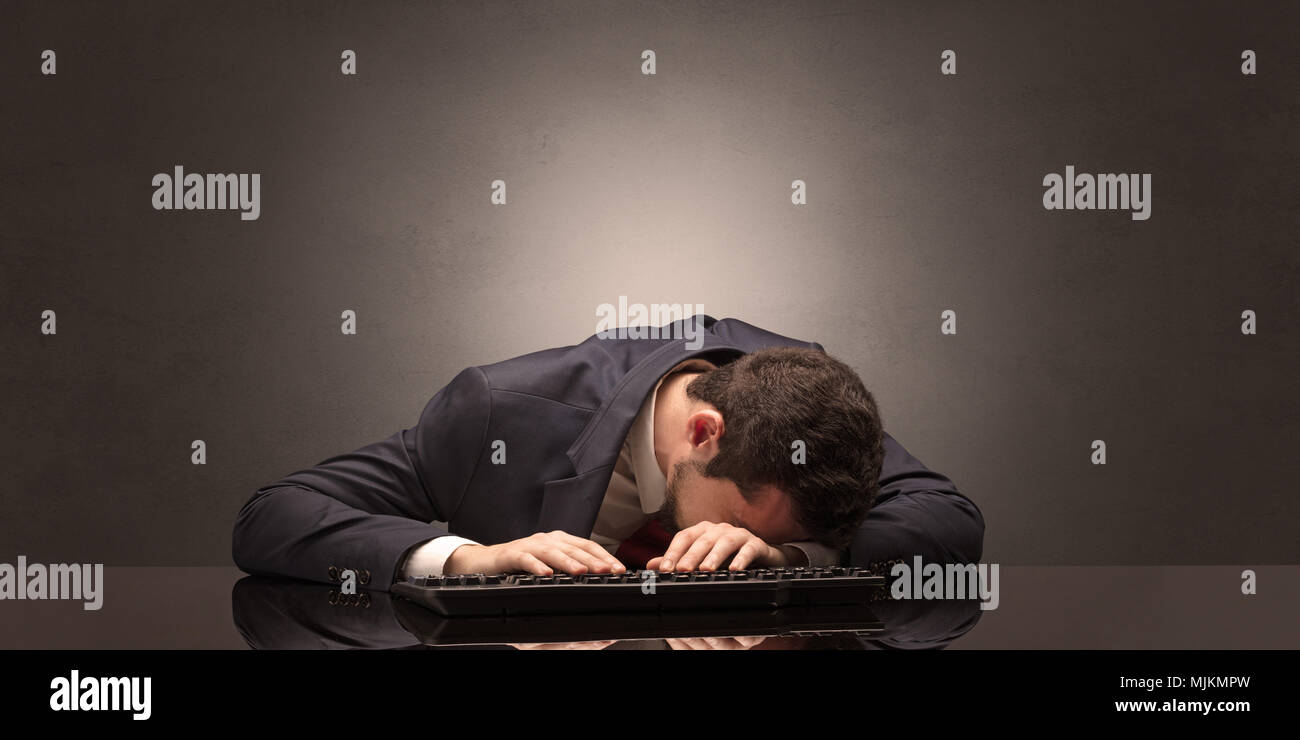 Elegant teacher fell asleep at his workplace with full draw blackboard ...