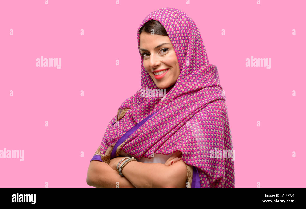 Young arab woman wearing hijab with crossed arms confident and happy ...