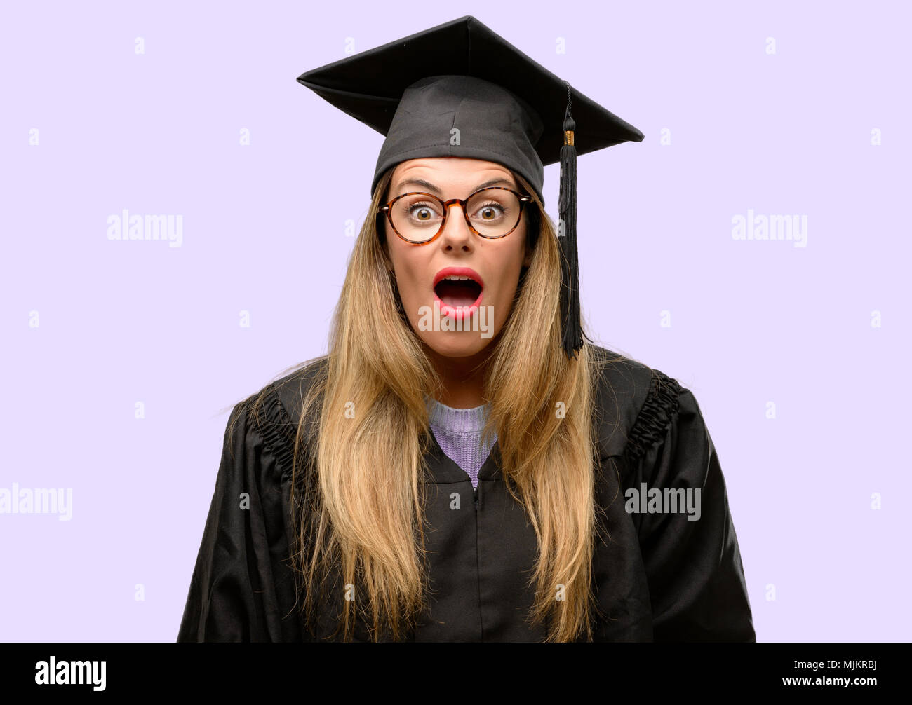 Young woman university graduate student scared in shock, expressing ...