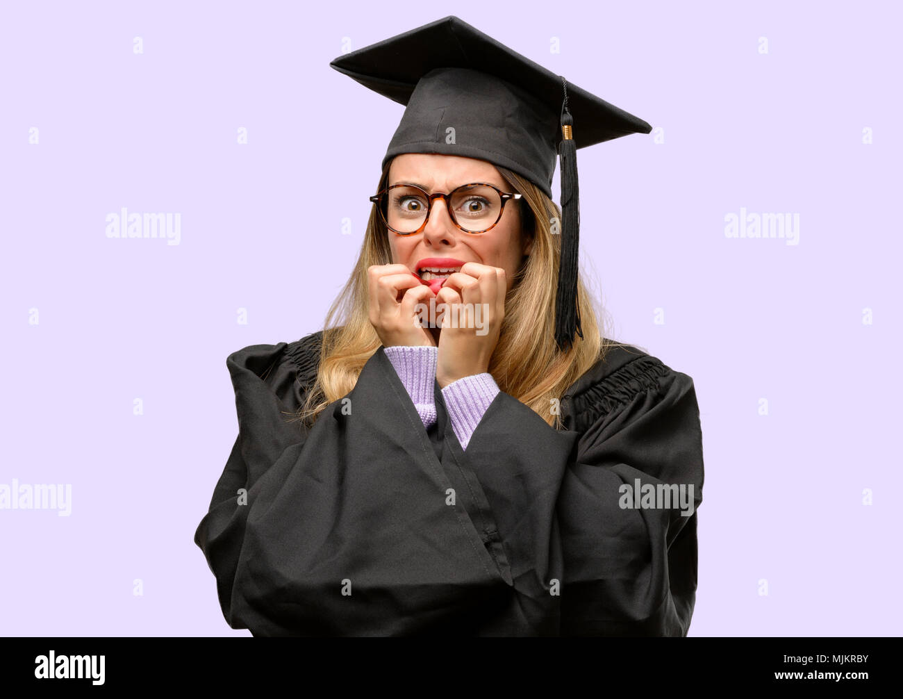 Young woman university graduate student terrified and nervous ...