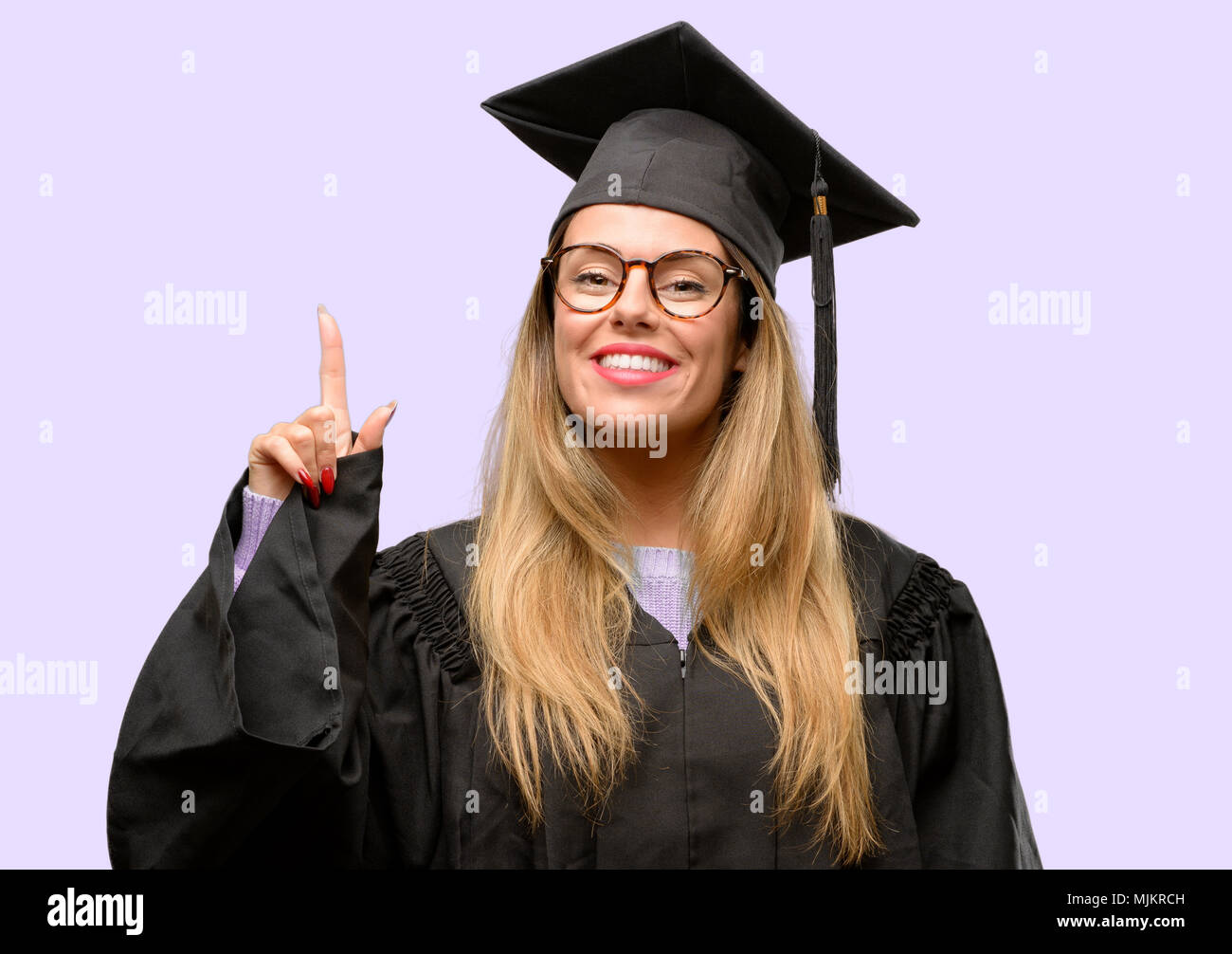 Woman student raising finger hi-res stock photography and images - Alamy