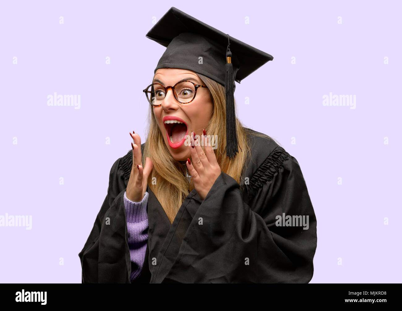 Young woman university graduate student stressful keeping hands on head ...