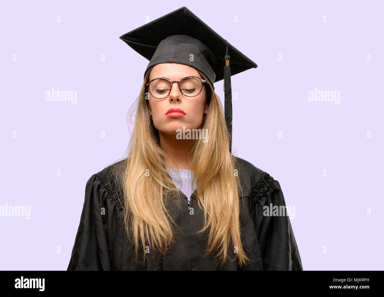 Young woman university graduate student with sleepy expression, being ...