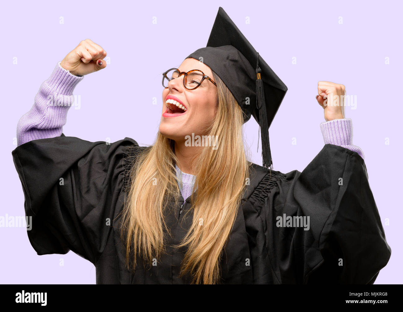 Young woman university graduate student happy and excited celebrating ...
