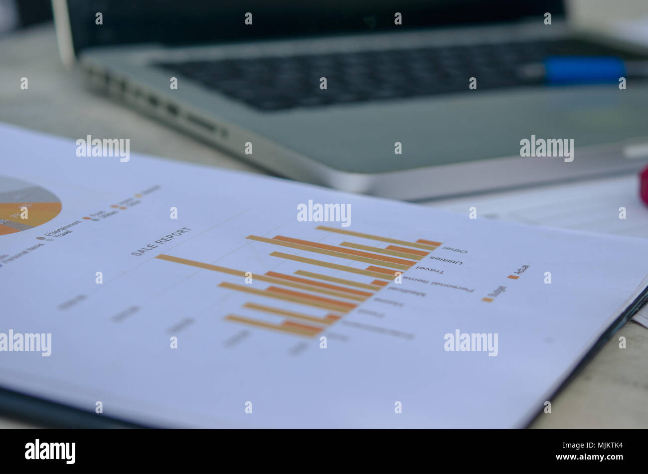 business Financial paper charts and laptop Stock Photo - Alamy