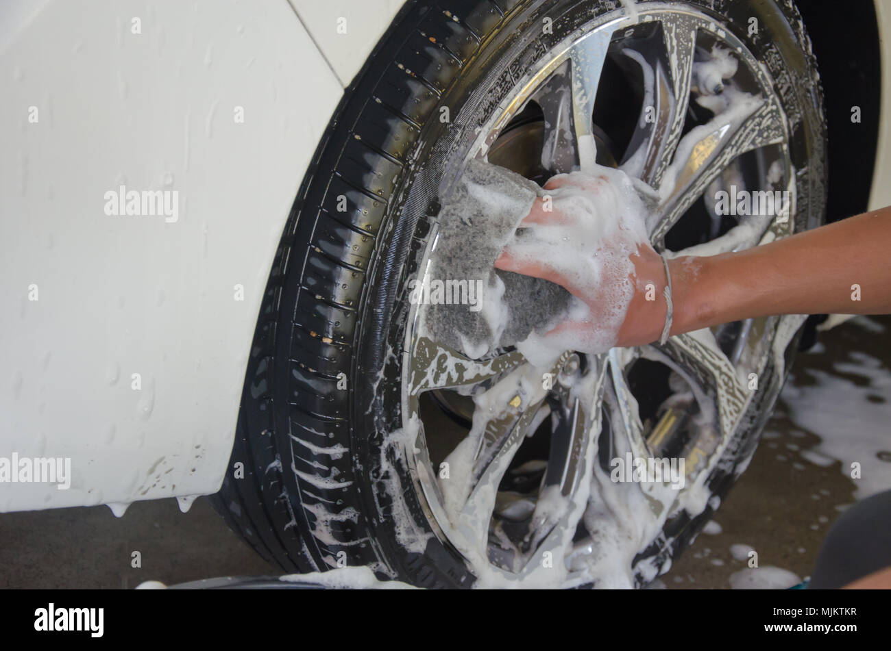 male hand washing wheel car Stock Photo - Alamy