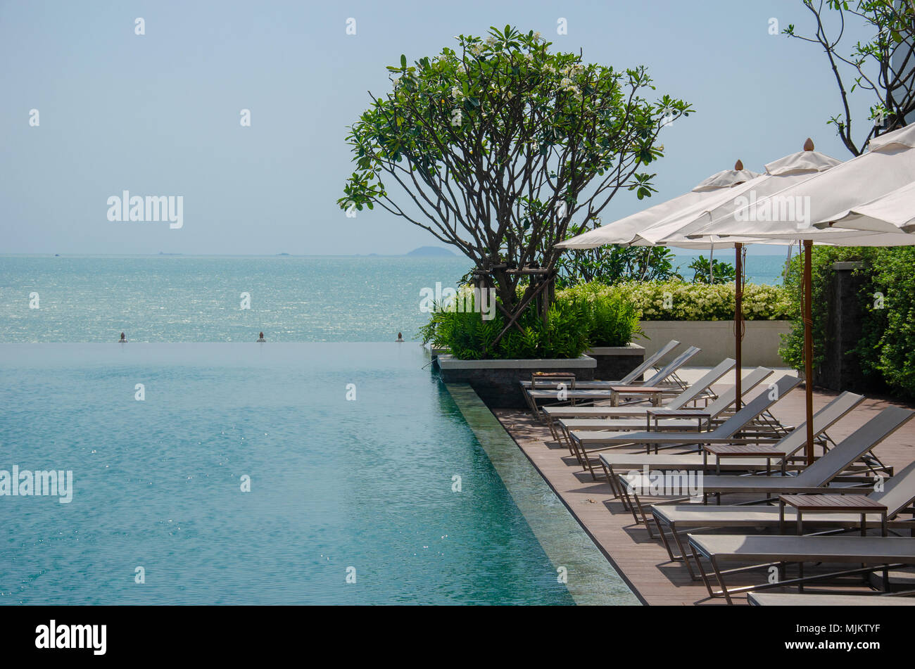 Swimming pool beautiful in tropical resort Stock Photo - Alamy
