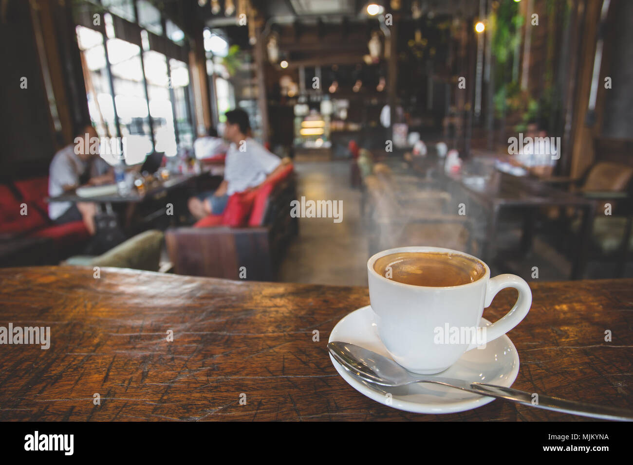 A cup of coffee in coffee shop Stock Photo - Alamy