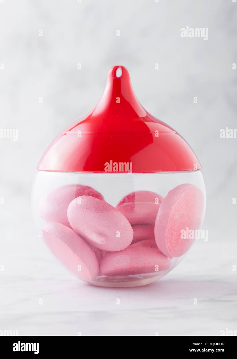Pink sweet meringue shells with fresh raspberries in plastic jar Stock ...