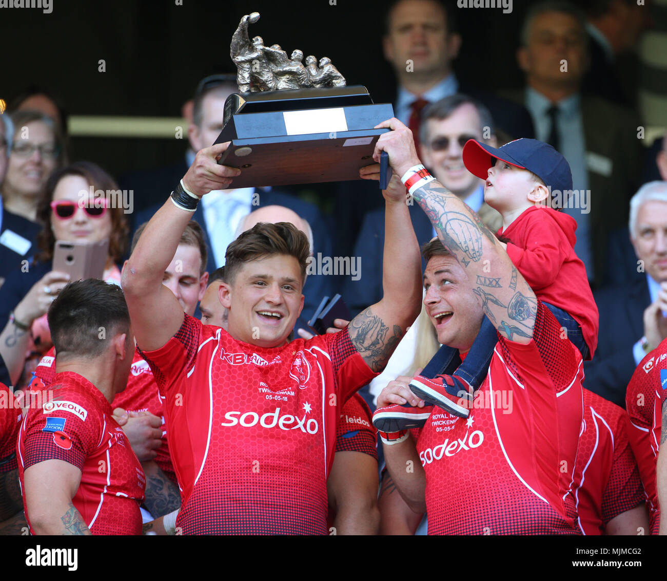 Vice-Captain Peter Austin (right, with his son) and Captain James Dixon ...