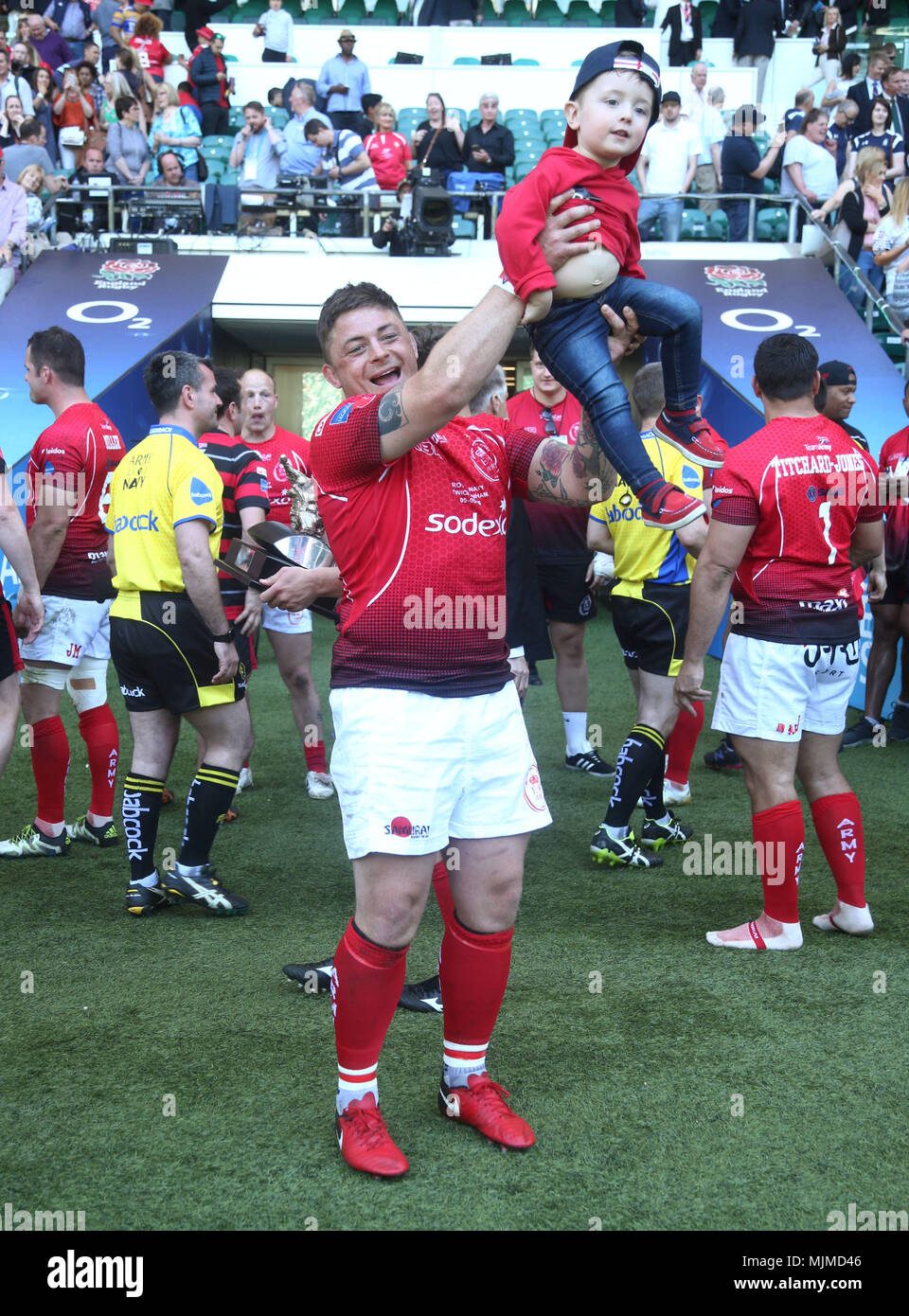Peter Austin of The British Army celebrates with his son after his side ...