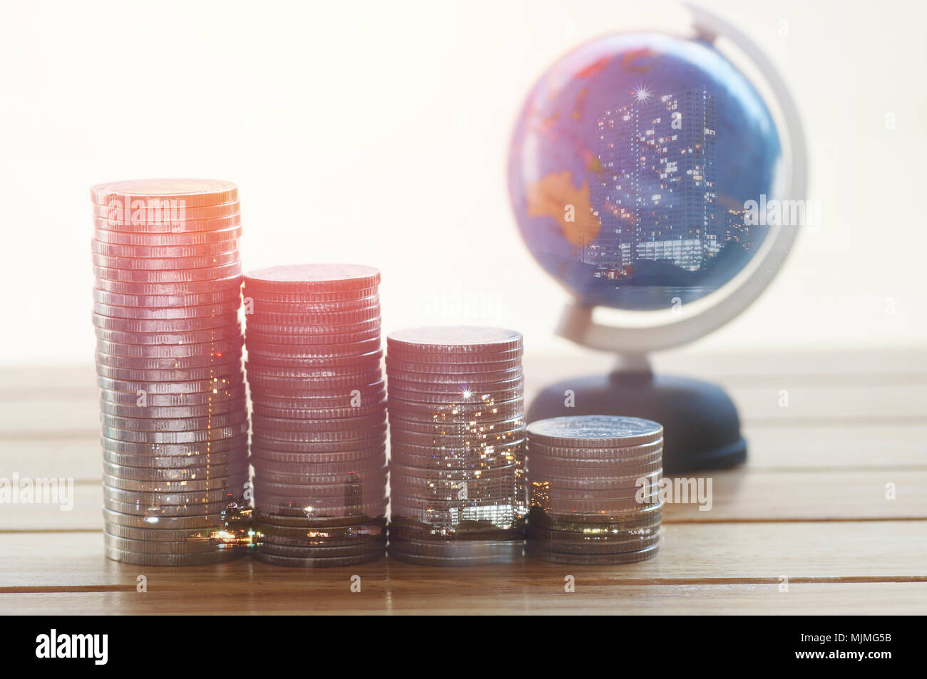 Map world globe coins hi-res stock photography and images - Alamy