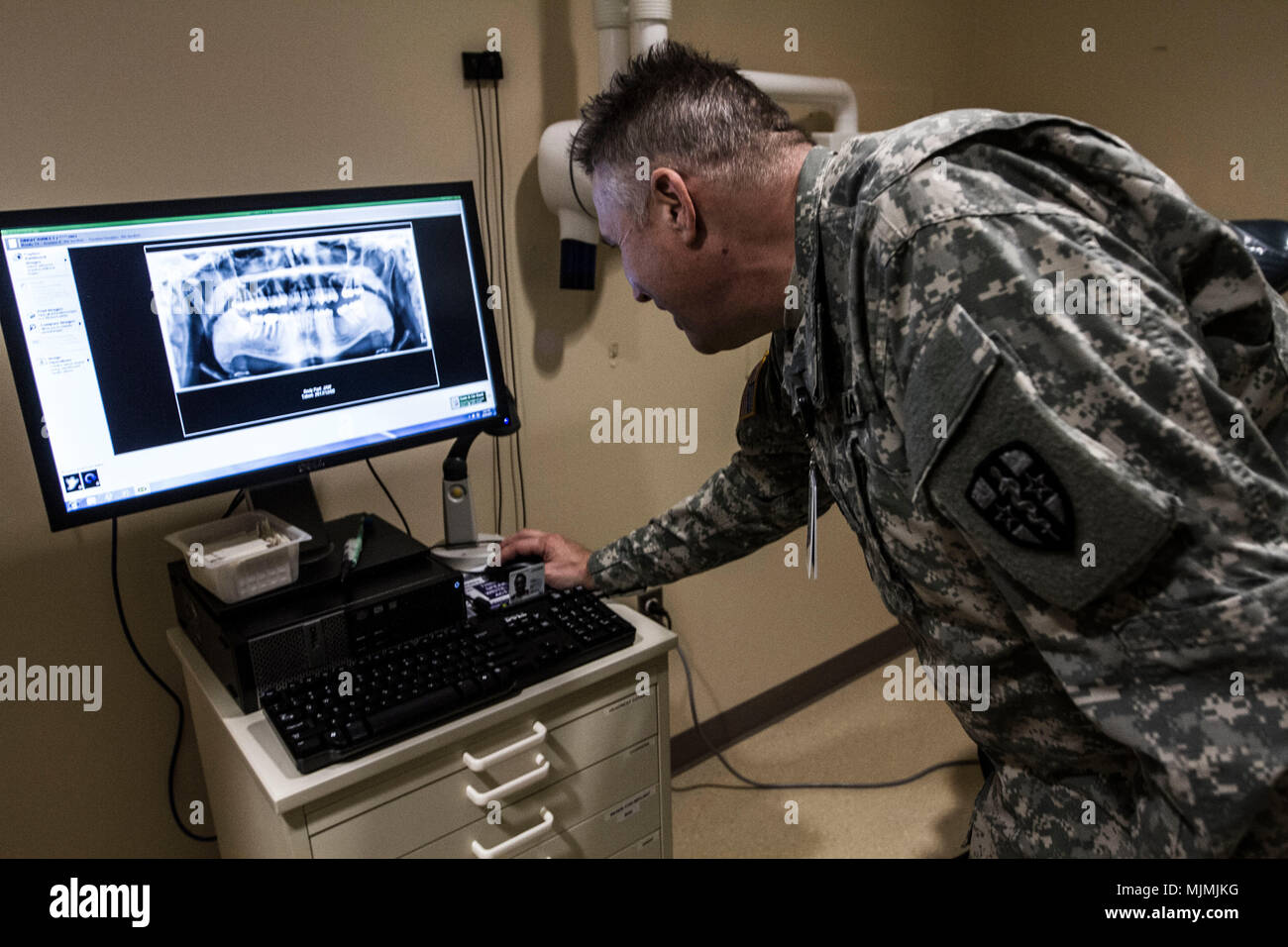 Sgt. Owen Roberts, 7250th Medical Support units, checks an x-ray during ...
