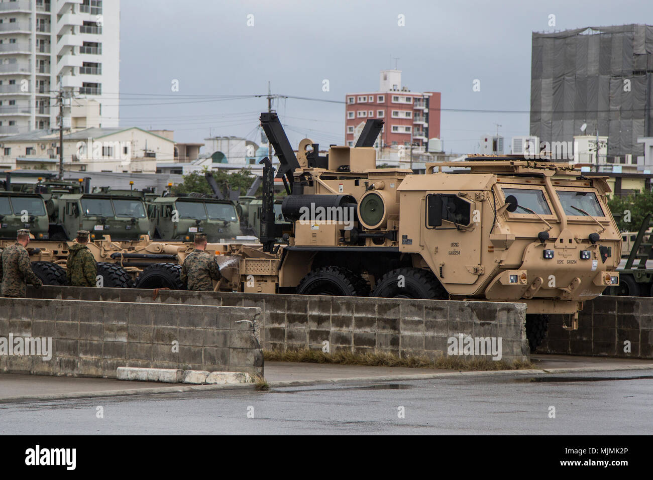 CAMP FOSTER, OKINAWA, Japan –Marines wash a MKR18 Logistic Vehicle ...