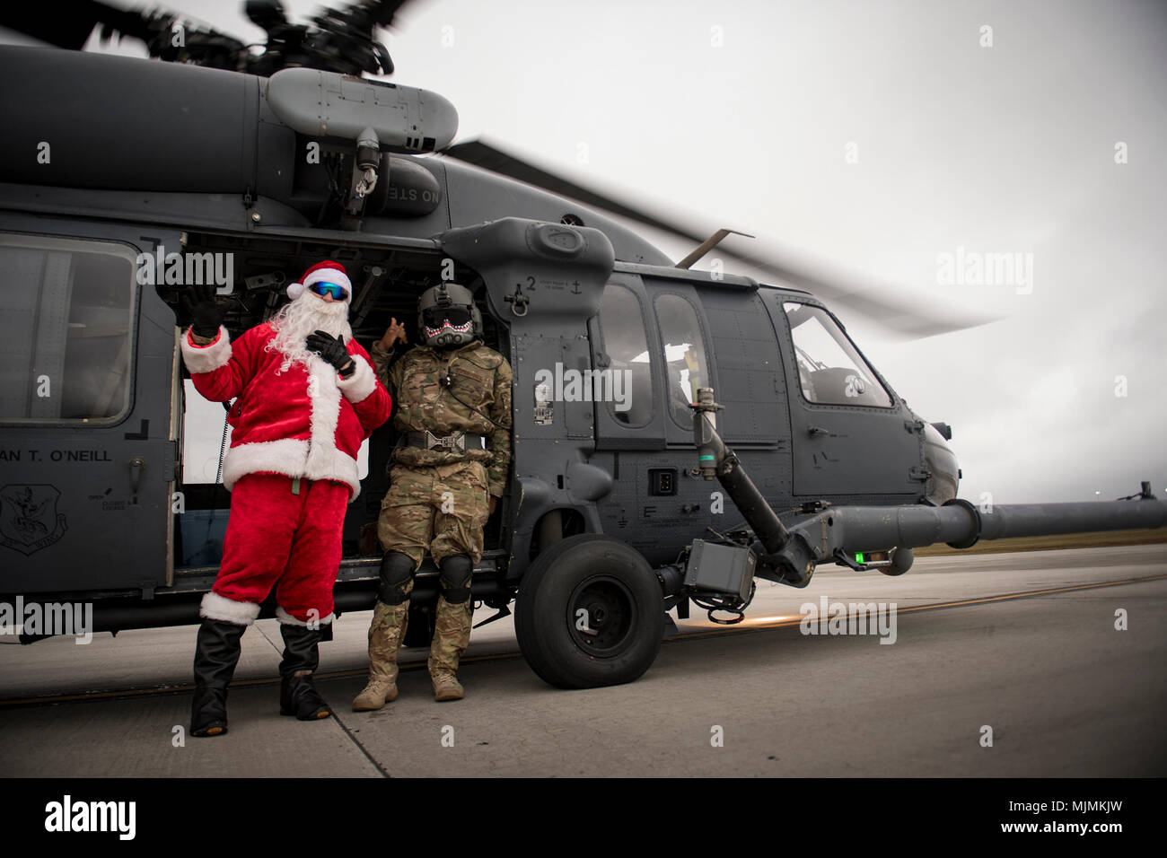 Santa poses for a photo with Tech. Sgt. Tareek Johnson, 41st Rescue ...