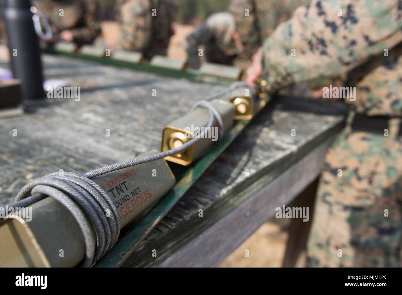Marines with 2nd Battalion, 8th Marine Regiment wrap detonation cord ...
