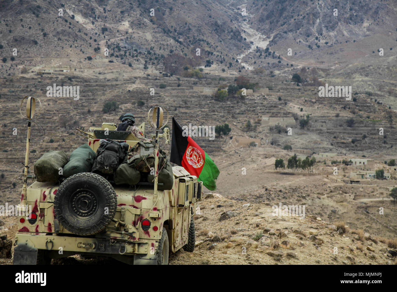 Afghan Commandos provide mounted security during a clearing operation ...