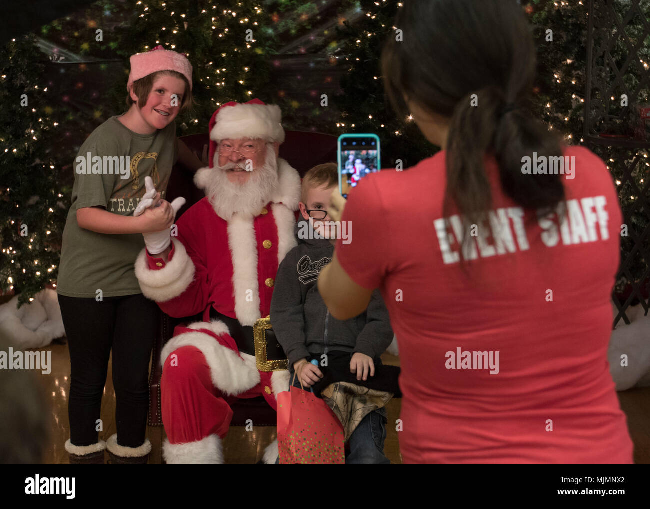 Fort Carson MWR volunteers help guests take pictures with Santa Claus ...