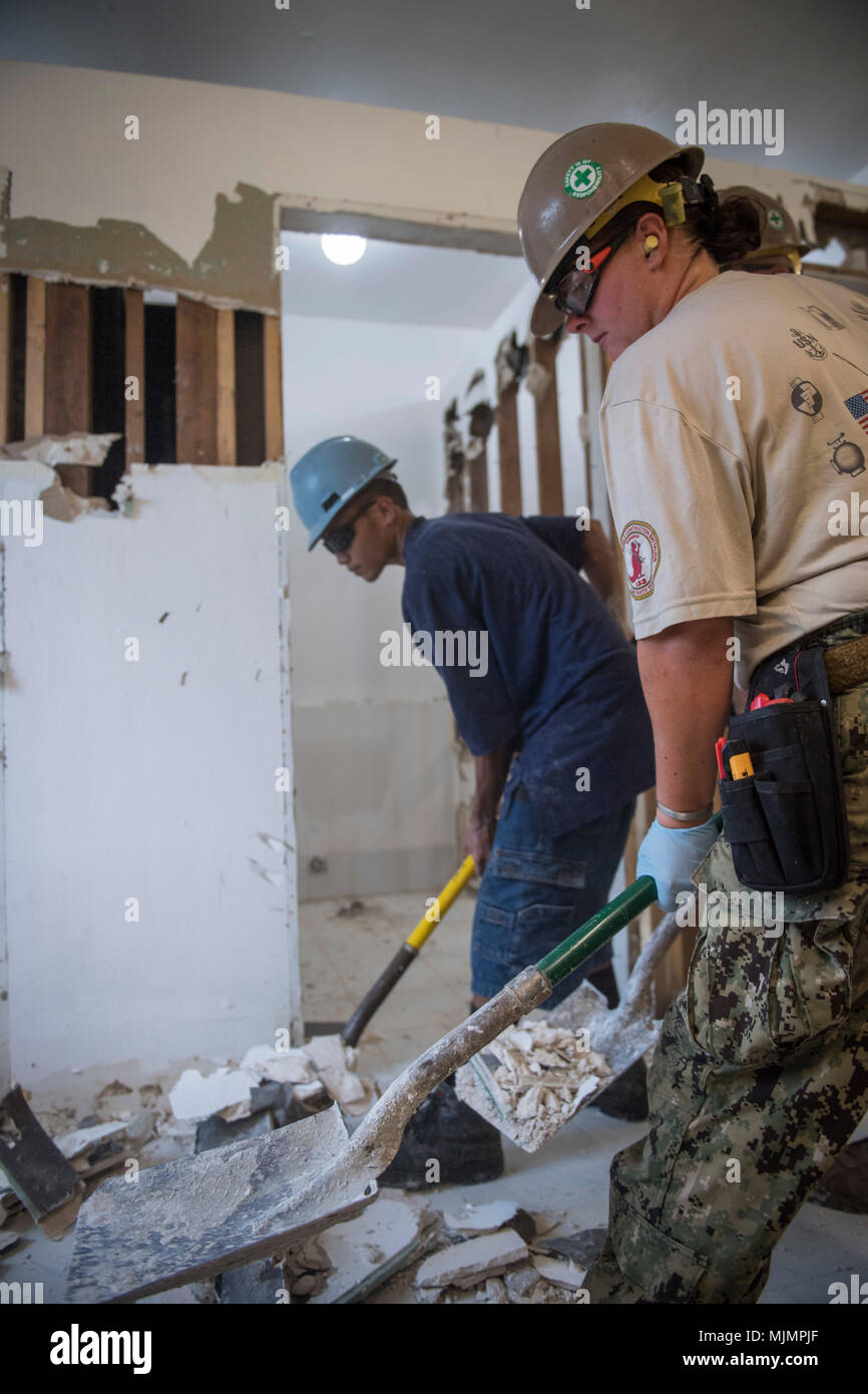 U.S. Navy Utilitiesman First Class Mariah Stanton, right, assigned to ...