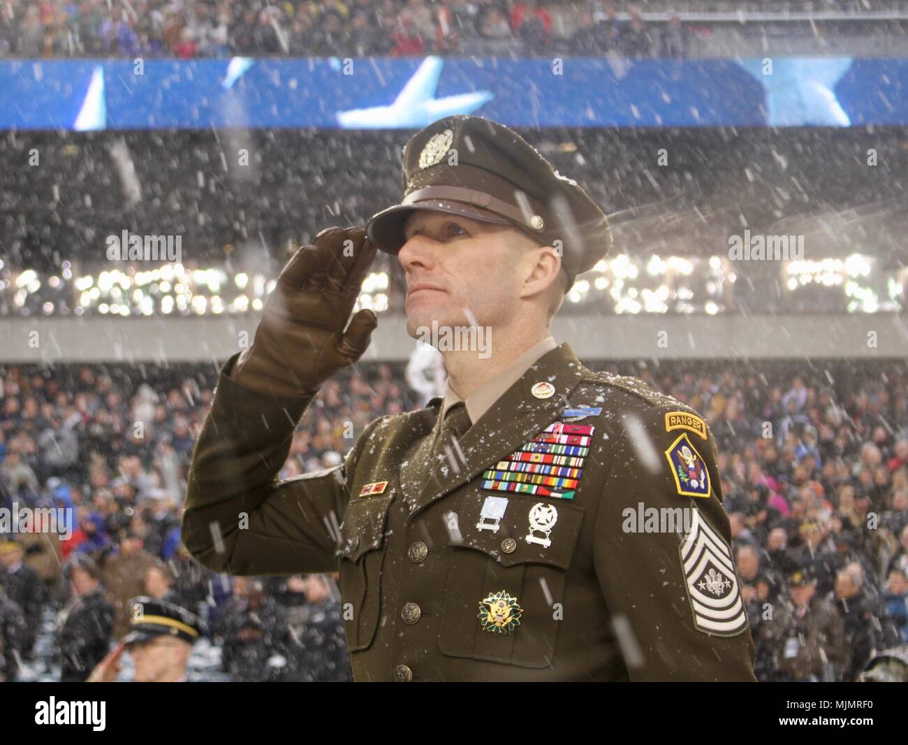 Sergeant Major of the Army Dan Dailey salutes the Anthem pre-kickoff ...