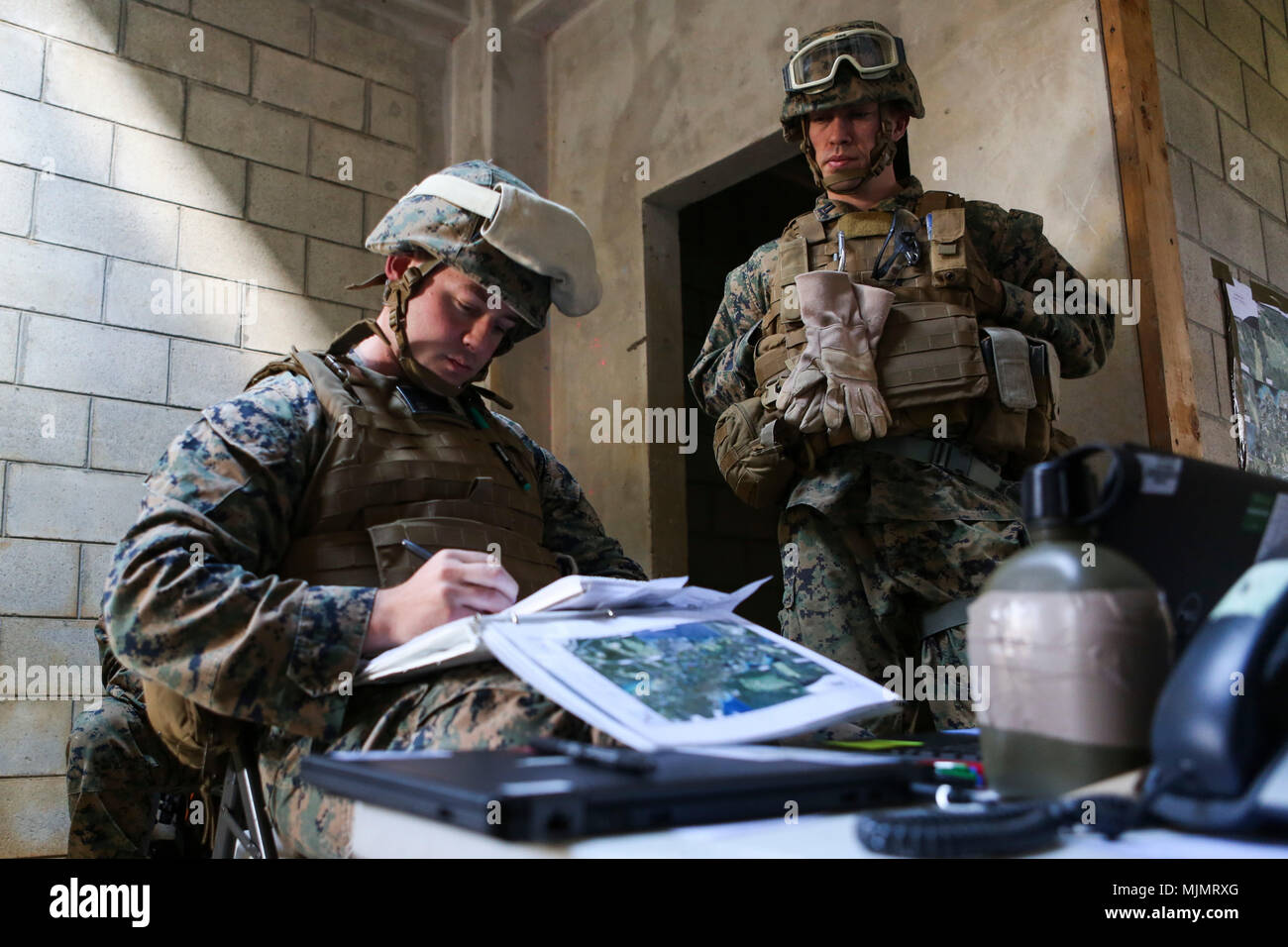 Marines with 3rd Marine Logistics Group Headquarters debrief during a ...