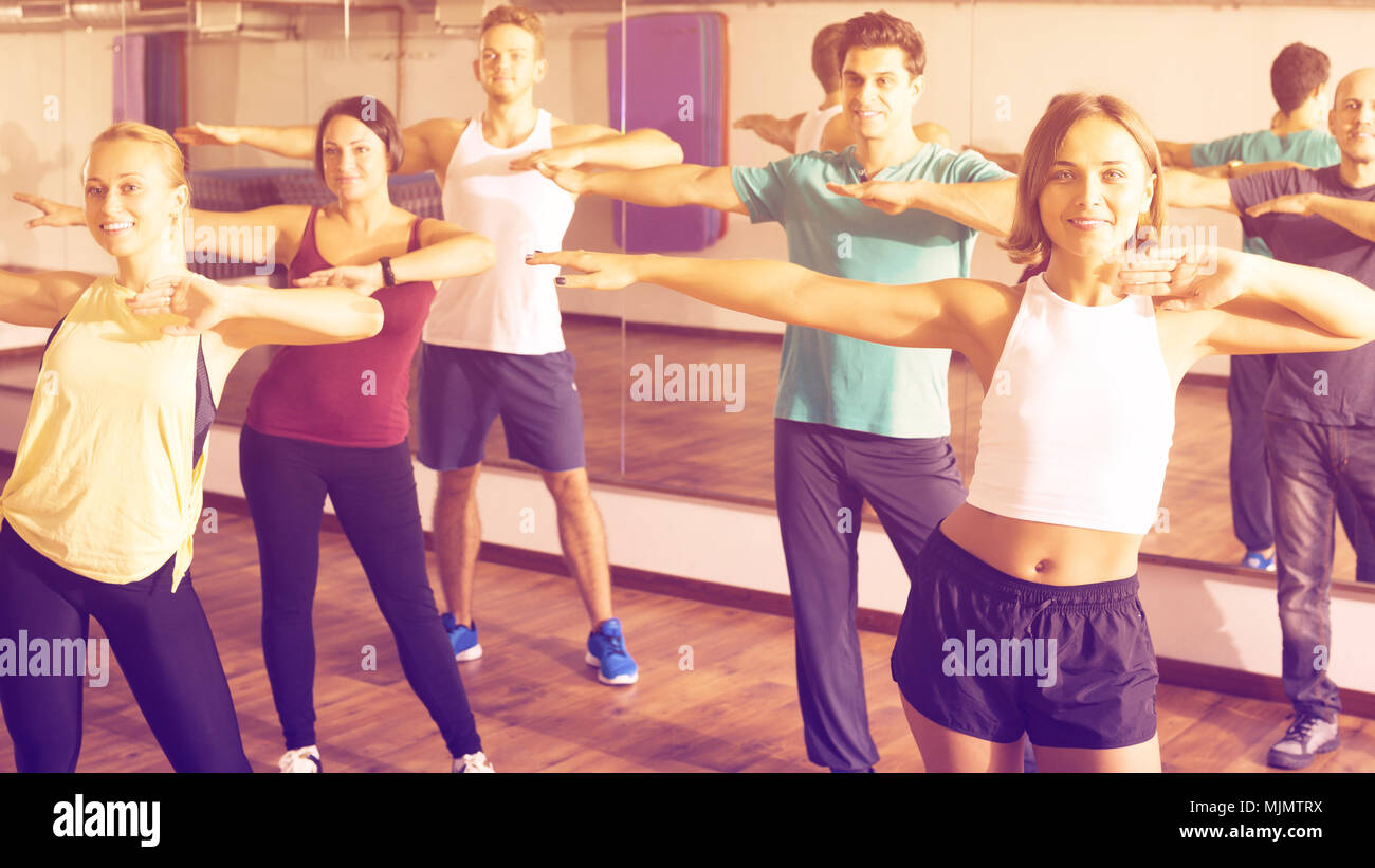 Smiling men and ladies dancing zumba at lesson Stock Photo - Alamy