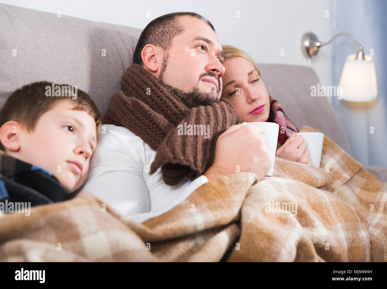 Family cold house blanket hi-res stock photography and images - Alamy