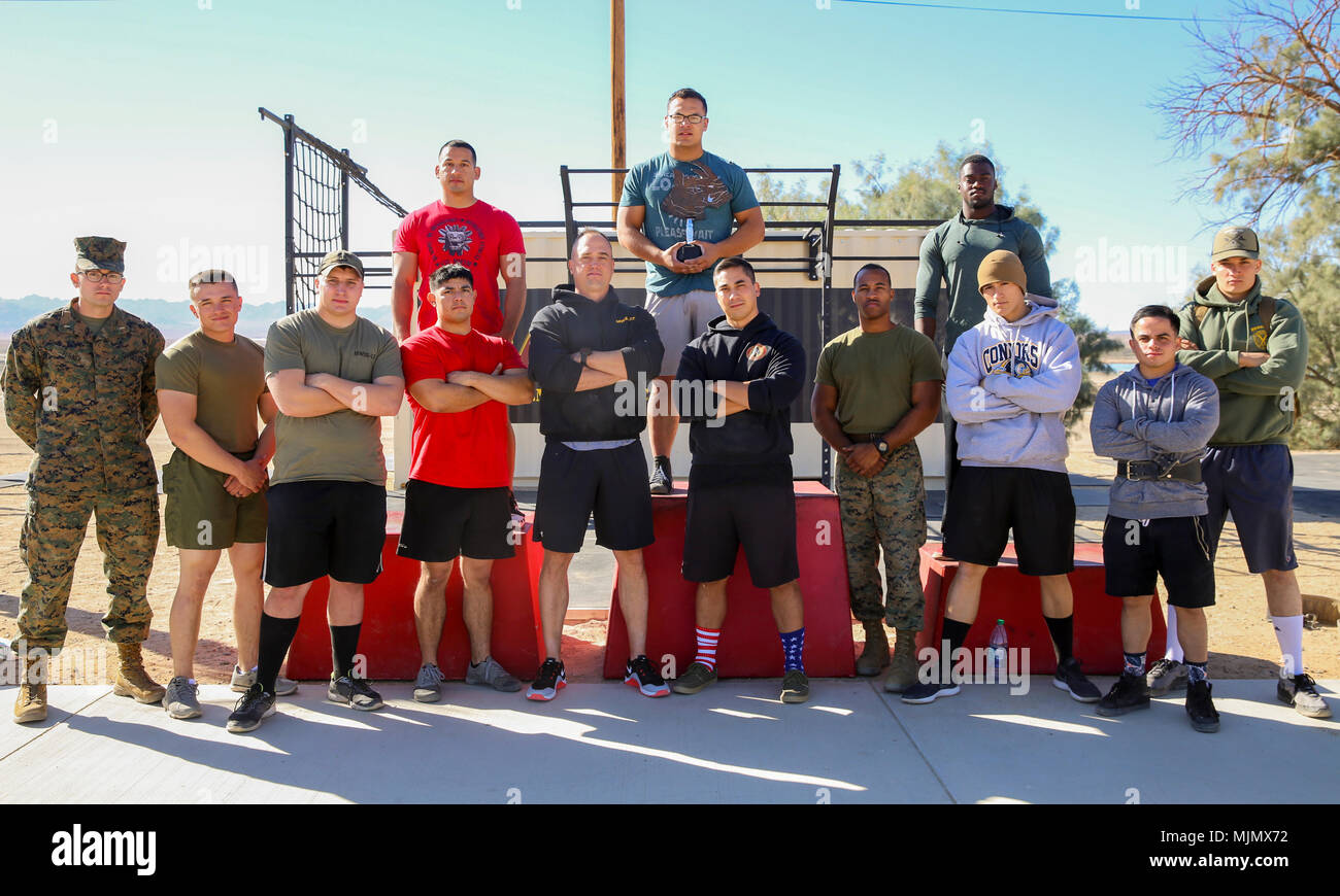 Marines with Marine Wing Support Squadron 374 stand with the winners of ...