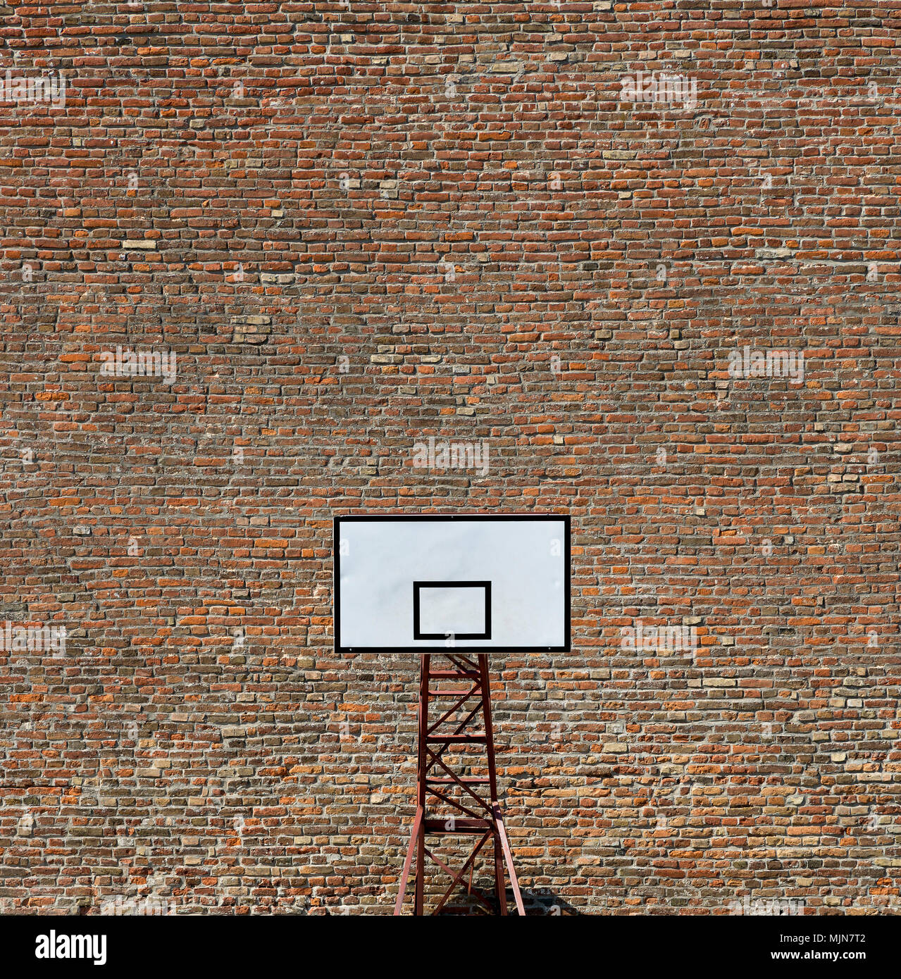 Basketball shield on a sports field on a brick wall background Stock ...