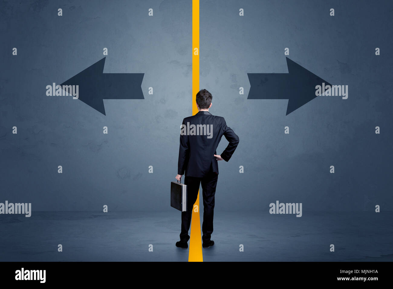Business person choosing between two options separated by a yellow ...