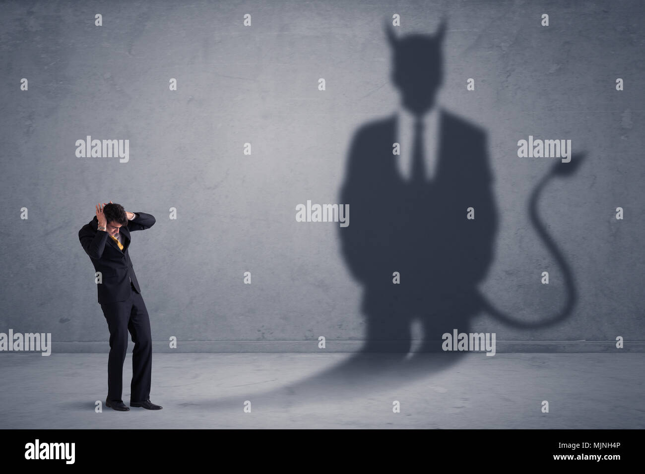 Business man angel shadow hi-res stock photography and images - Alamy