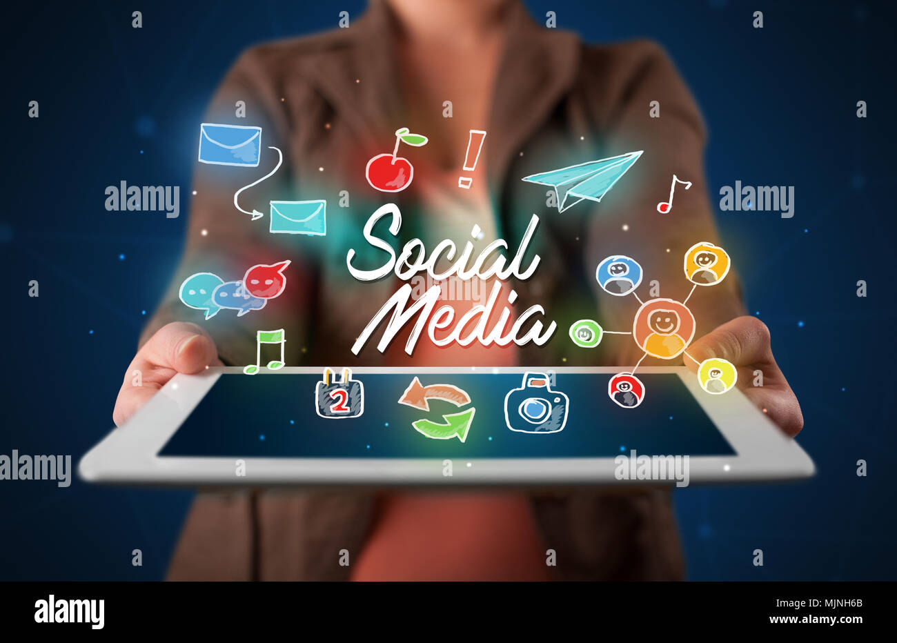Casual young woman holding tablet with social media icons Stock Photo ...
