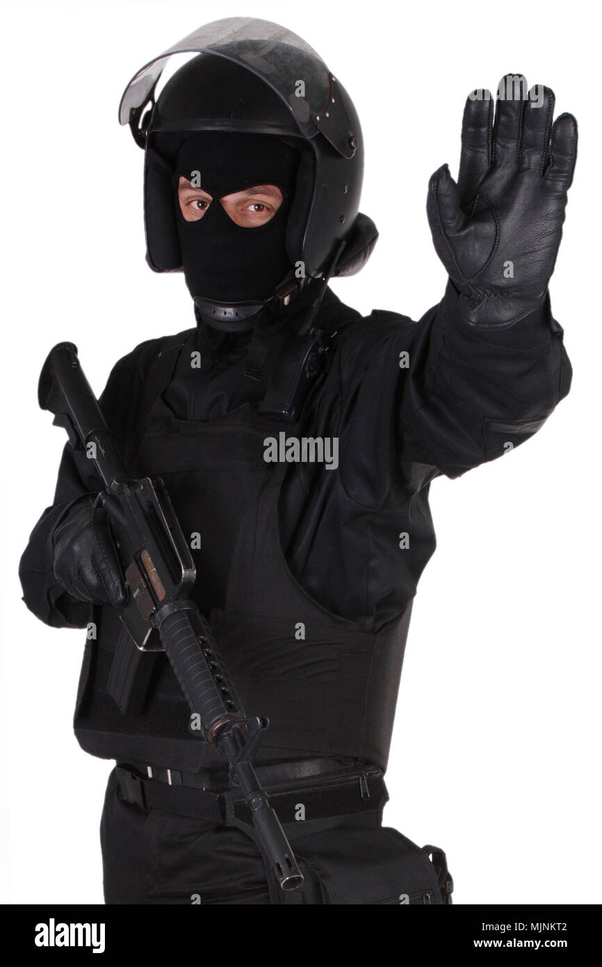 Riot police officer with weapon in black uniform isolated on white ...