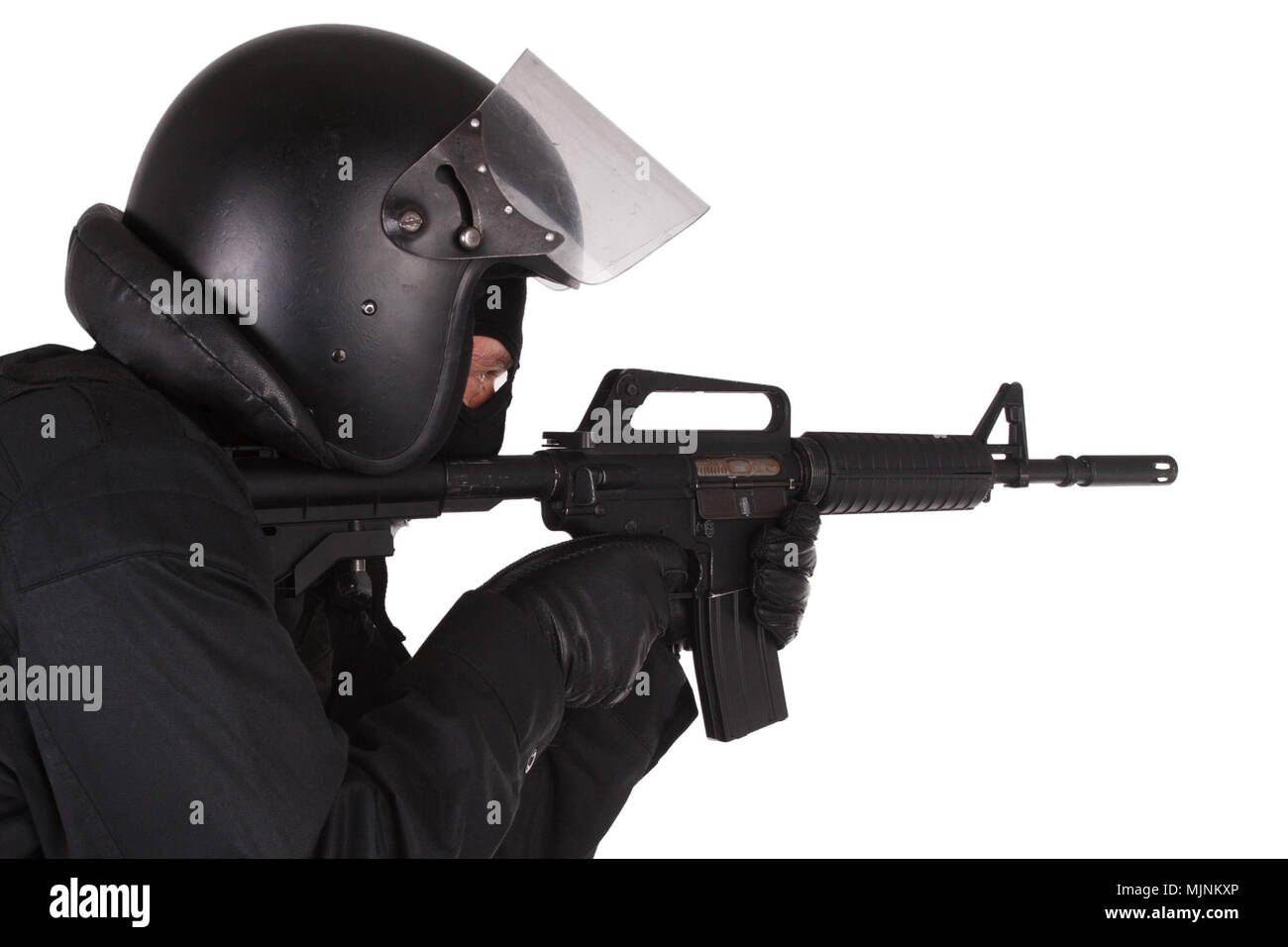 Riot police officer with weapon in black uniform isolated on white ...