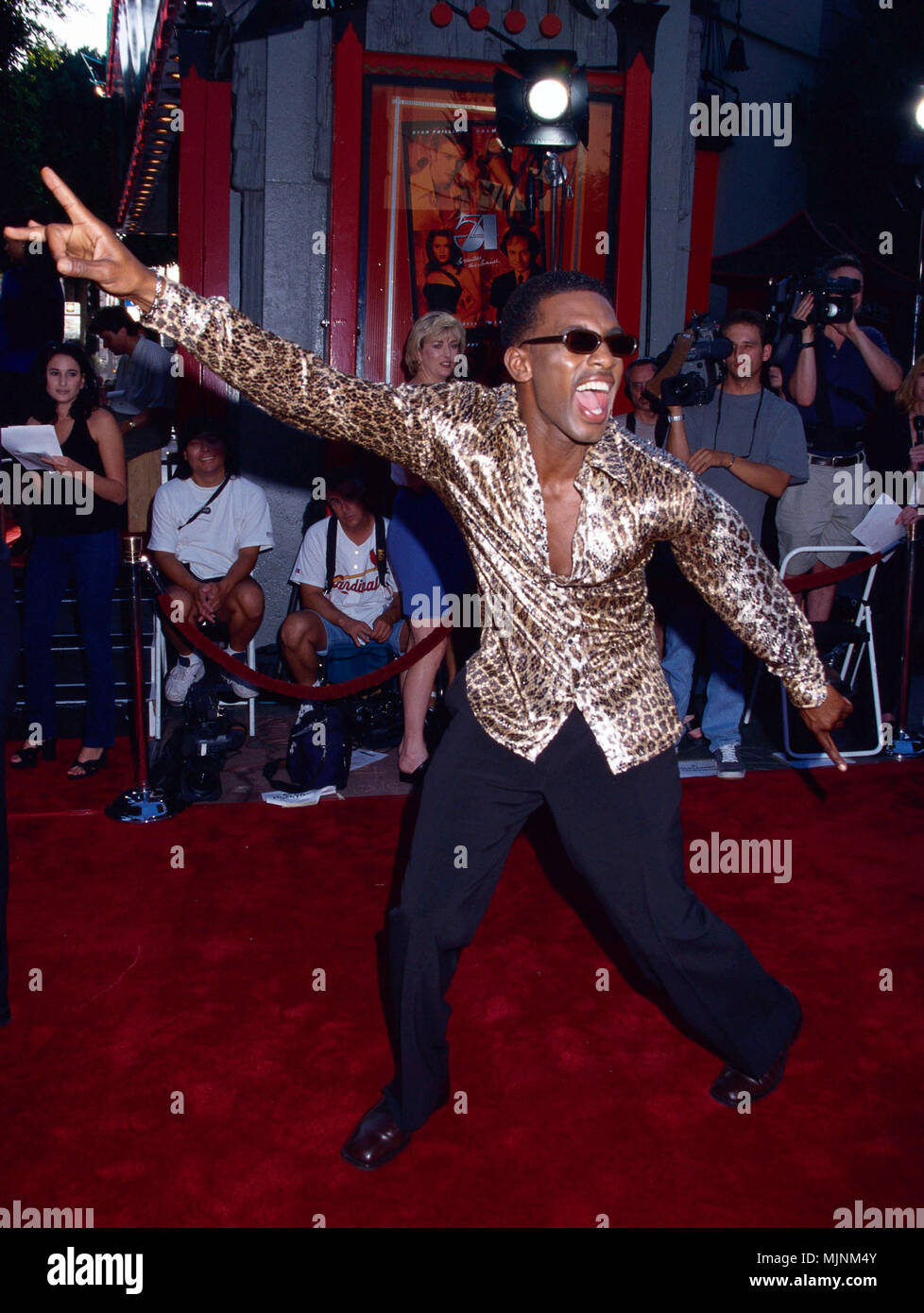 1998, USA --- Comedian Bill Bellamy strikes a disco dance pose at the ...