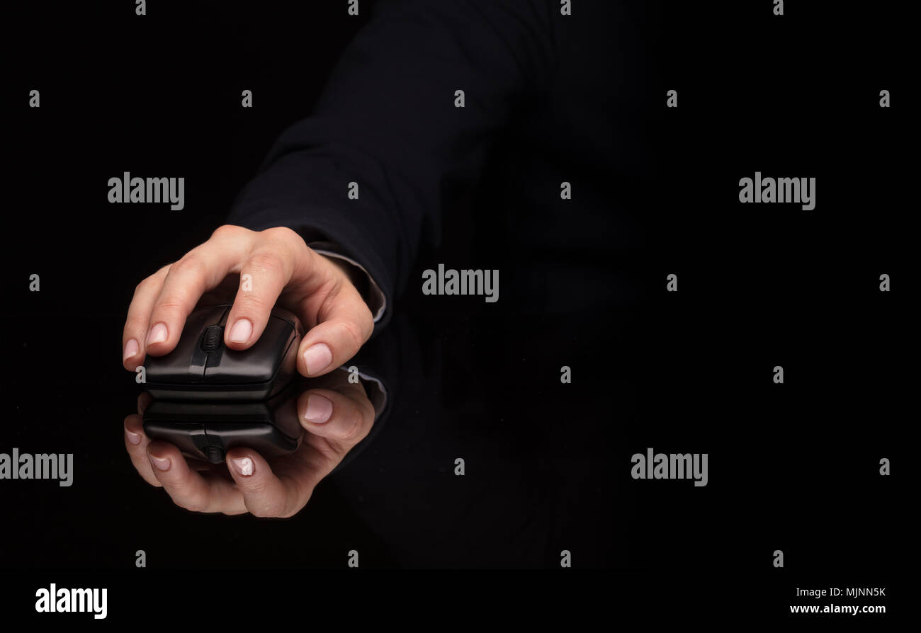 Hand using wireless mouse in a dark environment Stock Photo - Alamy