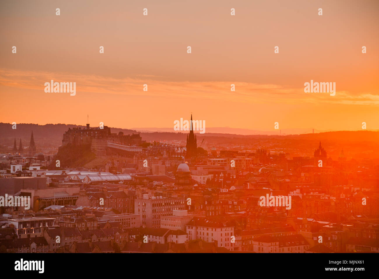 Edinburgh cityscape with Edinburgh Castle in background at sunset as ...