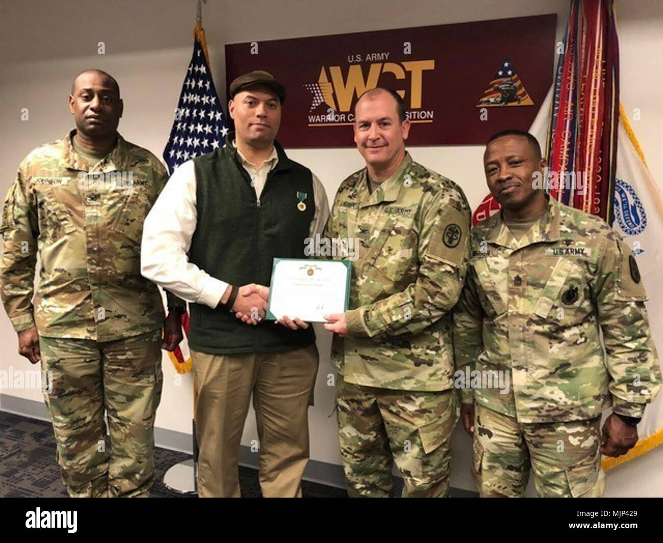 U.S. Army Reserve Capt. Brandon Henderson-Adams (second from left ...